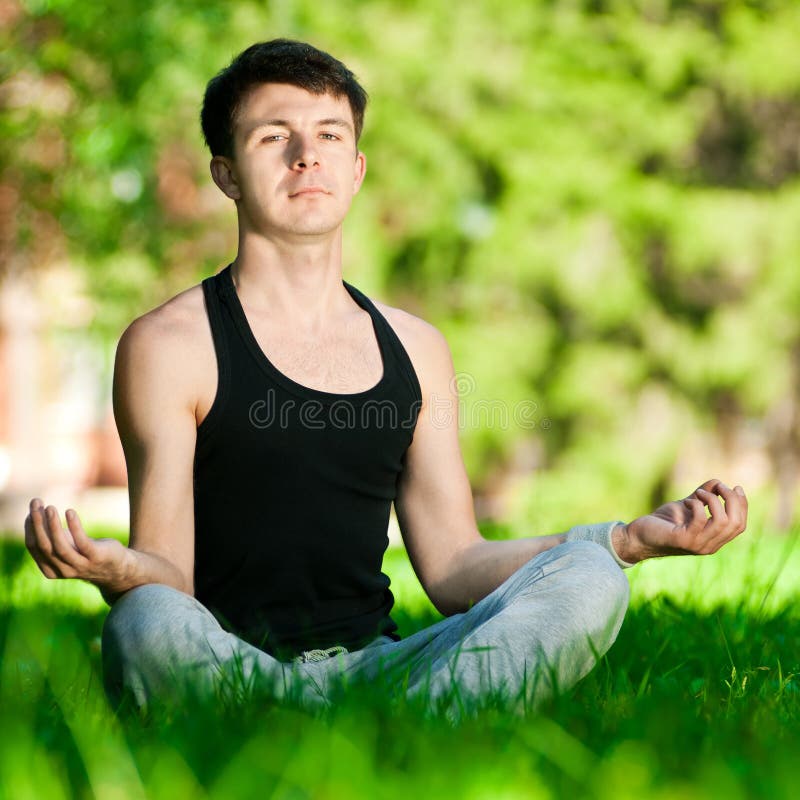 A Young Man Doing Yoga Exercise Stock Photo - Image of lady, meditation ...