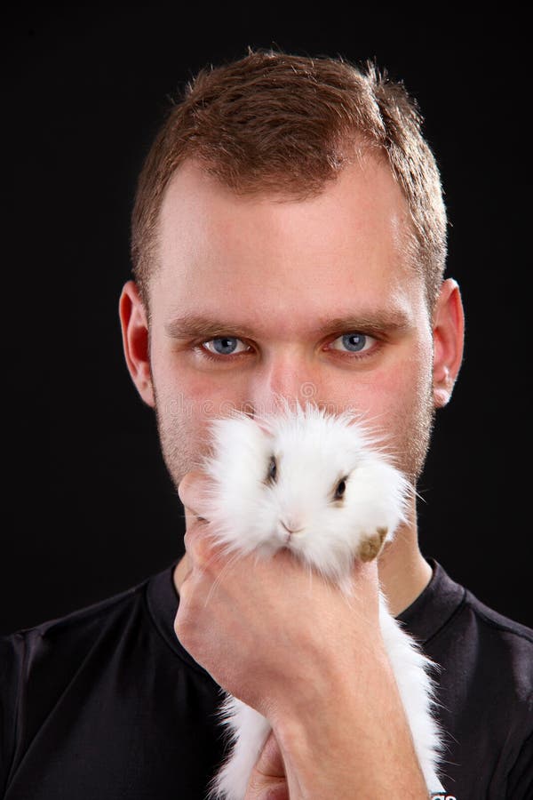 Young Handsome Man Holding His Pet Rabbit Stock Image - Image of fluffy ...