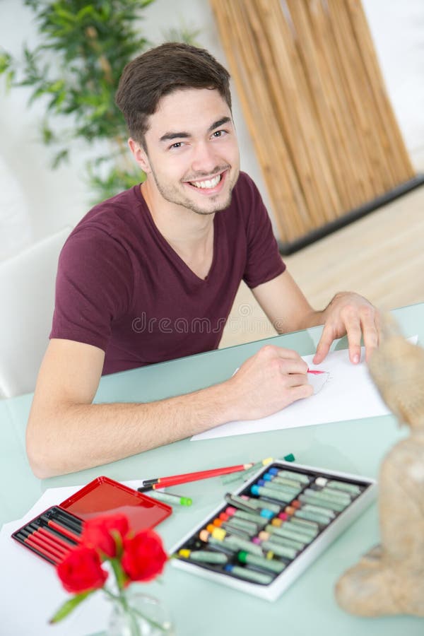 Young Man Drawing Pictures in Studio Stock Photo - Image of artist ...