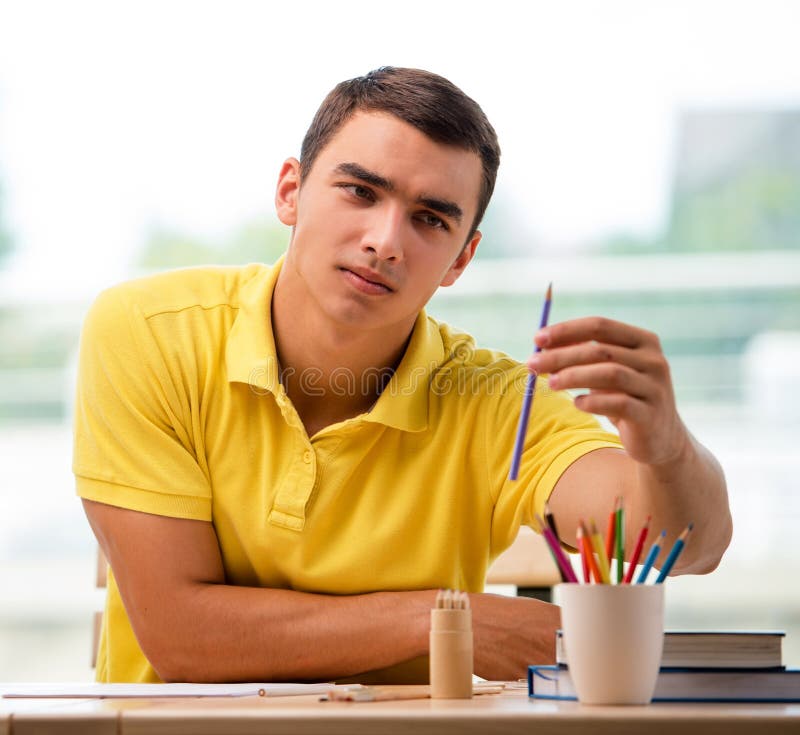 Young Man Drawing Pictures in Studio Stock Image - Image of artistic ...