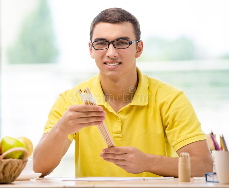 The Young Male Artist Drawing Pictures in Bright Studio Stock Photo ...