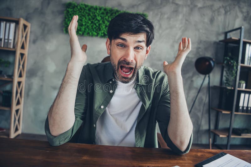 Frustrated Young Man Expressing Anger at Workplace in Casual Office ...