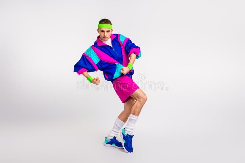Young Man in Colorful Retro Sportswear Doing Dynamic Exercise on White ...