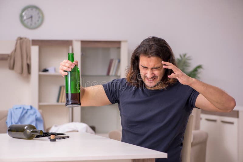 Young Unemployed Man Drinking Alcohol at Home Stock Image - Image of ...