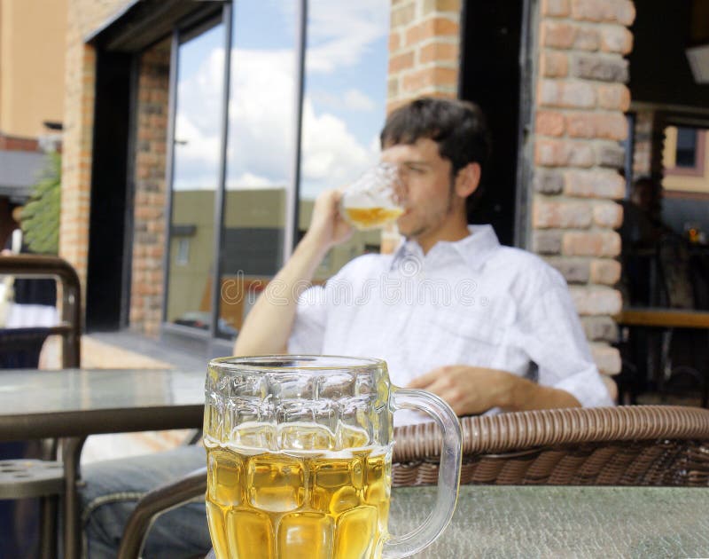 Young man drinking beer stock photo. Image of light, afternoon - 32591880