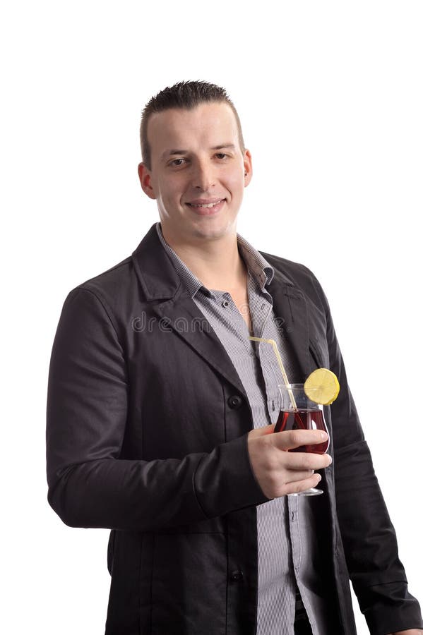 Young Man Drinking a Cocktail Stock Image - Image of smiling, standing ...