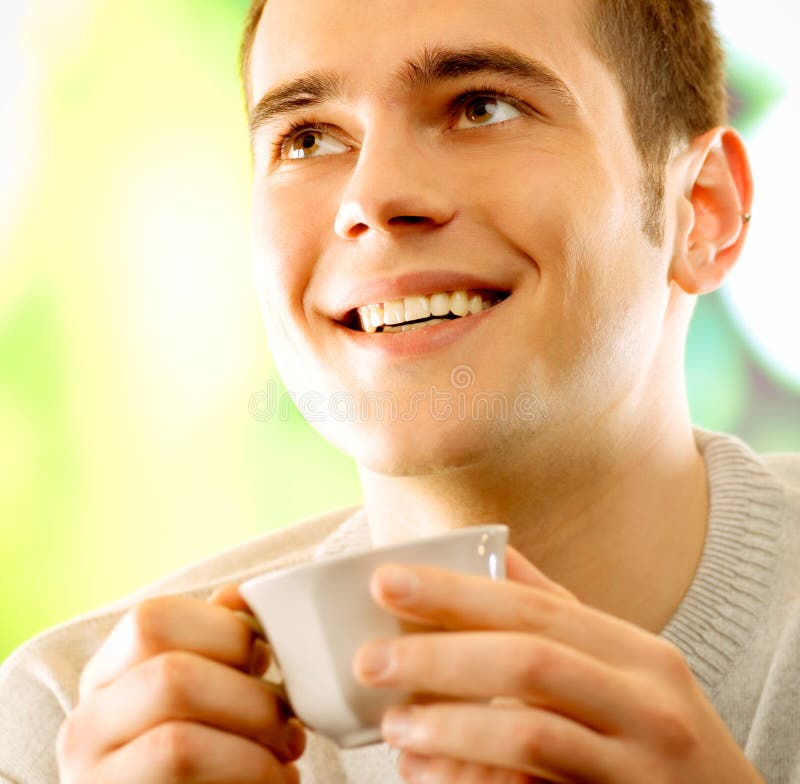 Young man drinking coffee stock photo. Image of portrait - 2496526