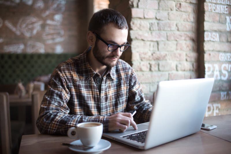 Young man drinking coffee stock image. Image of handsome - 64443501