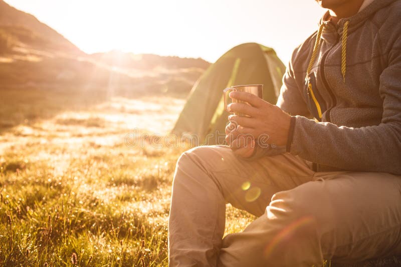 Young Man Drinking Tea at Sunrise in Mountains. Stock Photo - Image of ...