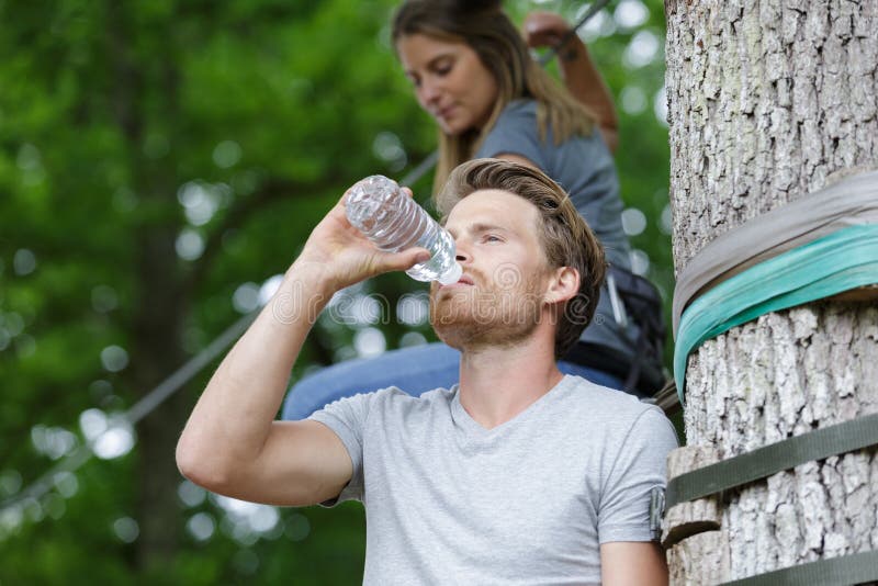 Young Man Drinking Water in Nature Stock Photo - Image of fitness ...