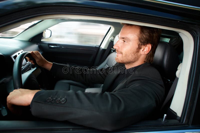 Young Man Driving Luxury Car Smiling Stock Image - Image of collar ...