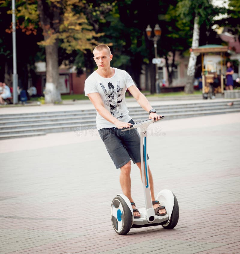 Young Man Driving on Segway in the Park. Stock Photo - Image of hobbies ...