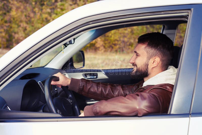 Young Man Driving White Car Stock Photo - Image of happy, elderly: 61136642