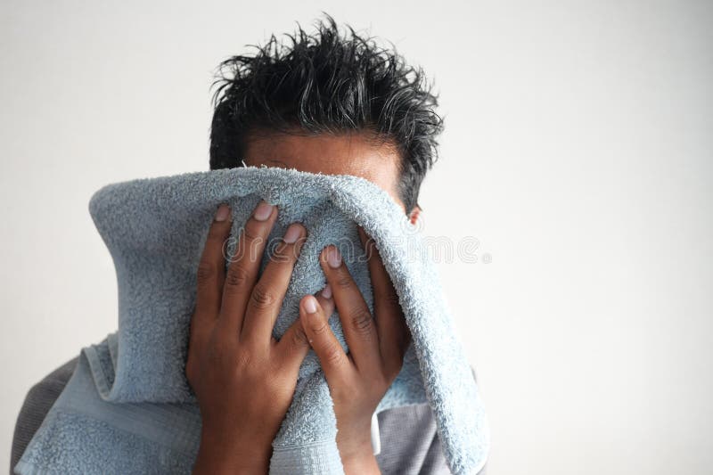 Young Man drying his face. stock image. Image of care - 301831107
