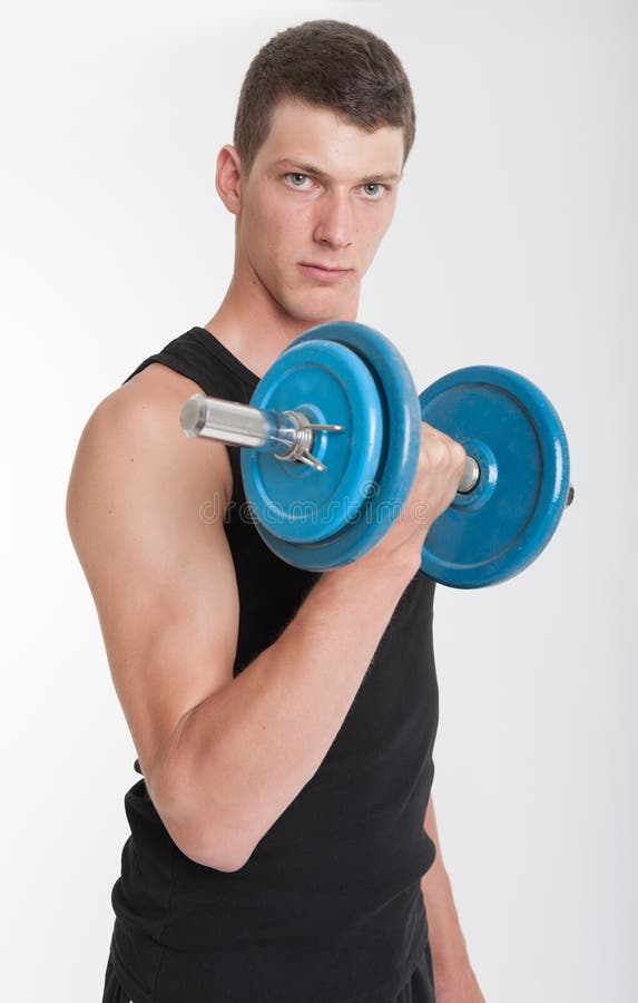 Young man with dumbbell stock image. Image of hand, routine - 34469837