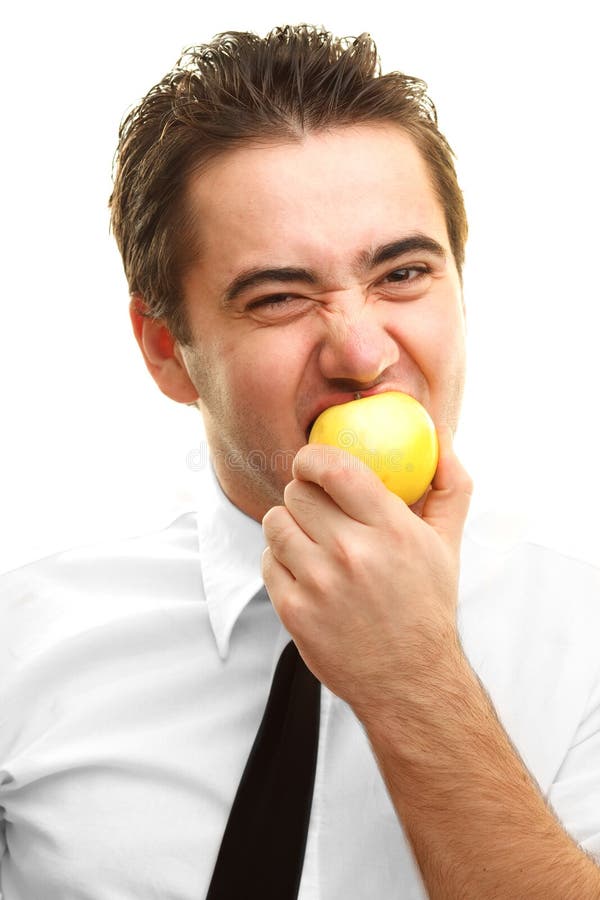 Young man eating apple stock image. Image of hair, face - 12227409