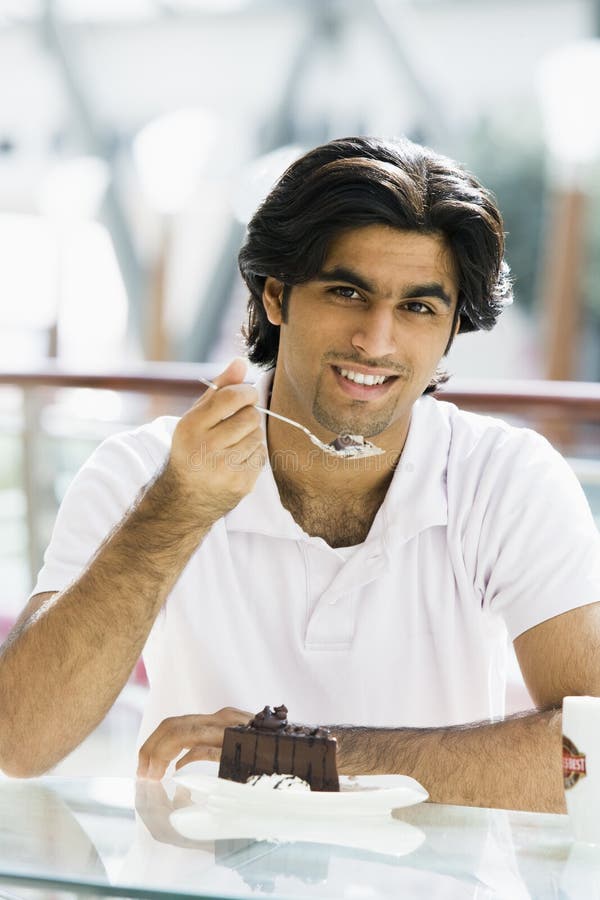 Young Boy Eating Chocolate Cake in Cafe Stock Image - Image of glass ...