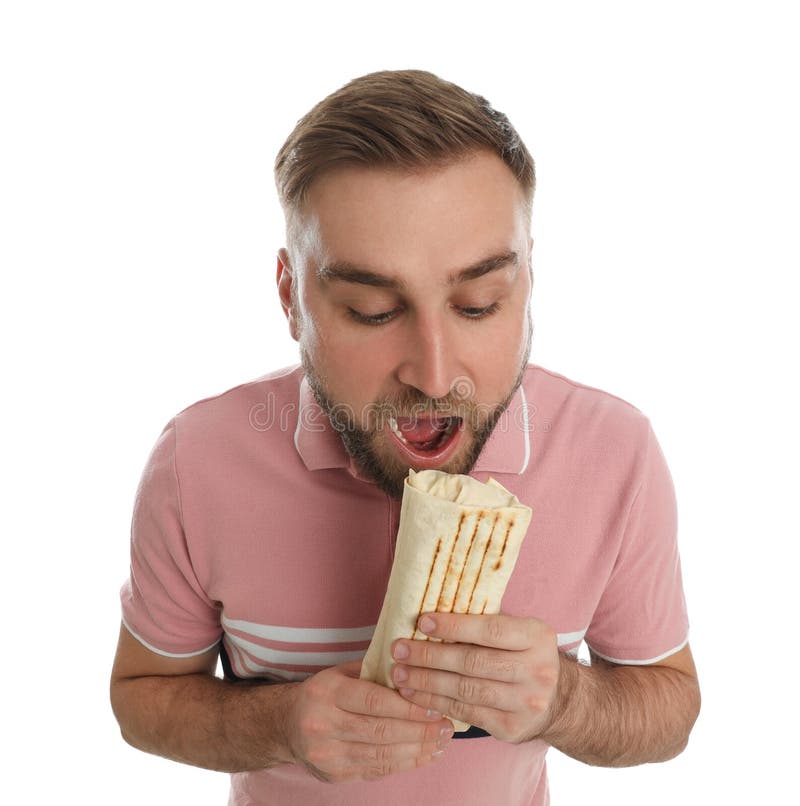 Young Man Eating Delicious Shawarma on White Background Stock Image ...