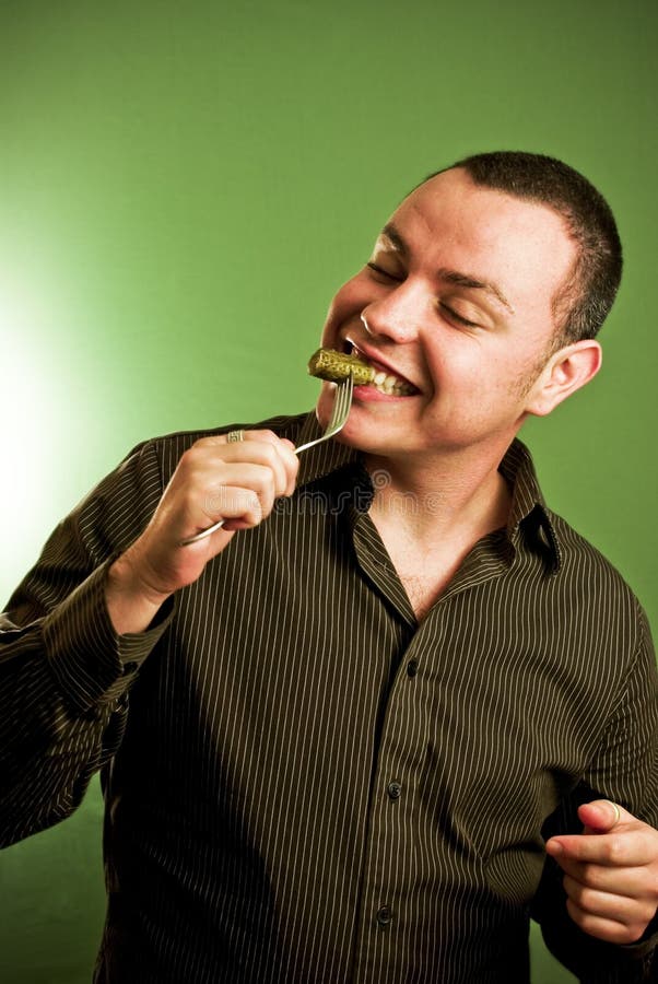 Young man eating from fork stock image. Image of foodie - 3521407