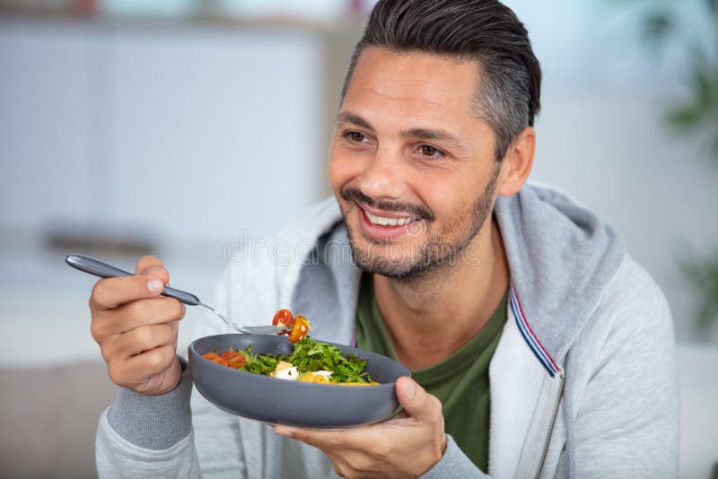 Young Man Eating Healthy Salad Stock Image - Image of lifestyle, cook ...