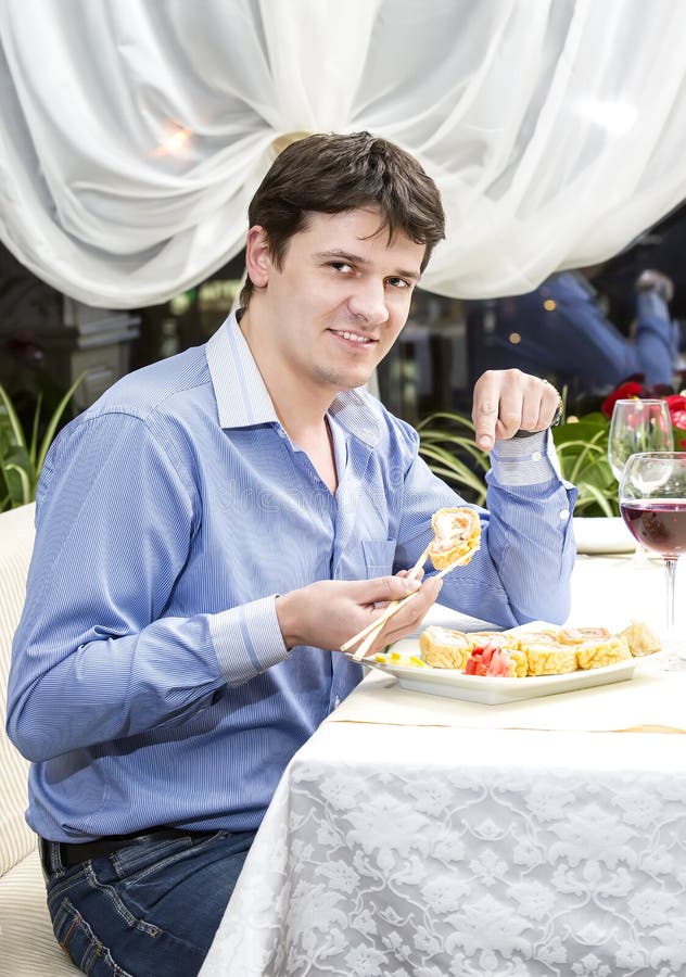 Young man eating stock photo. Image of beauty, enjoy - 36642566