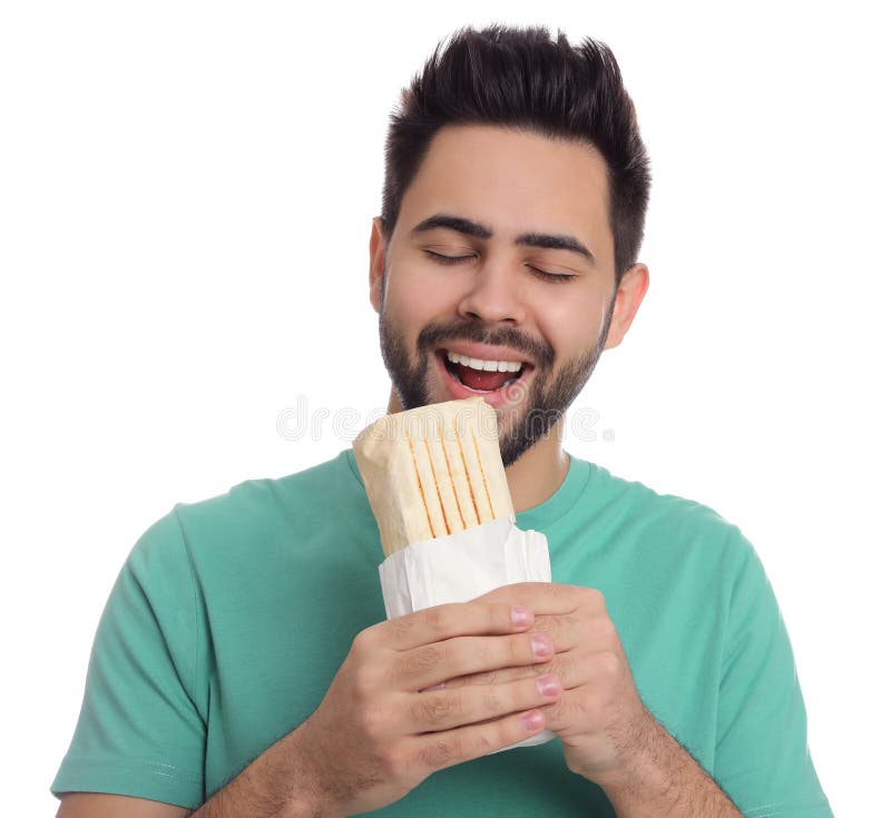 Young Man Eating Tasty Shawarma on White Stock Photo - Image of ...