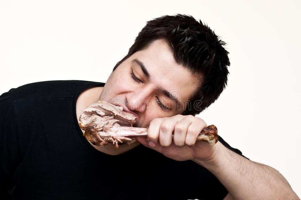 Young Man Eating a Turkey Leg Stock Photo - Image of looking, mouth ...