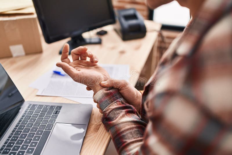 Young Man Ecommerce Business Worker Suffering for Wrist Pain at Office ...