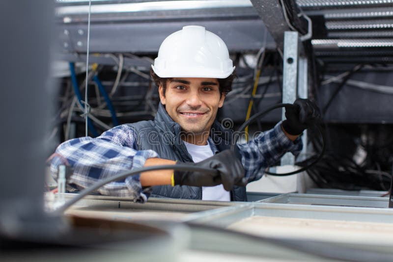Young Man Electrician Wiring Inside Ceiling Stock Photo - Image of ...