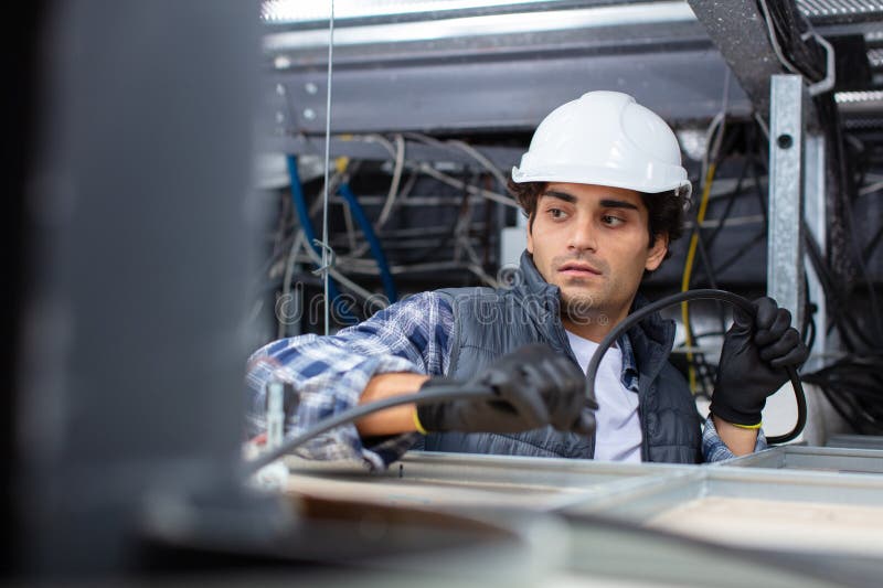 Young Man Electrician Wiring Inside Ceiling Stock Photo - Image of ...