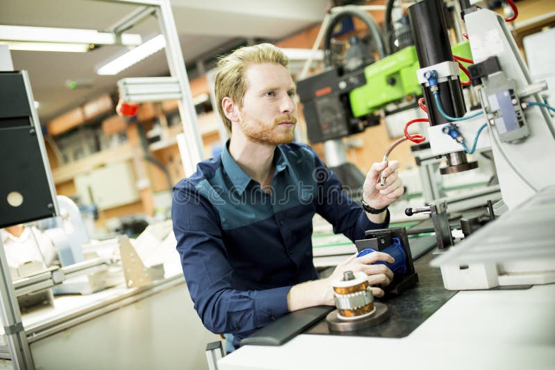 Young Man in Electronics Workshop Stock Photo - Image of technology ...
