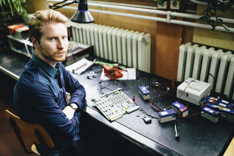 Young Man in Electronics Workshop Stock Image - Image of activity ...
