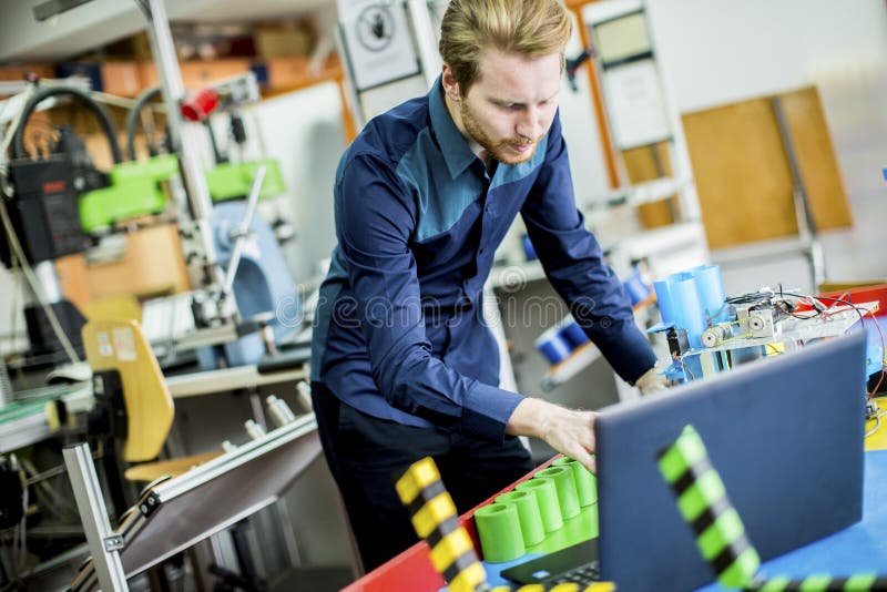 Young Man in Electronics Workshop Stock Image - Image of electricity ...