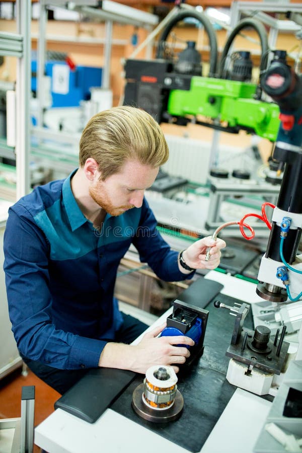 Young Man in Electronics Workshop Stock Image - Image of engineer ...
