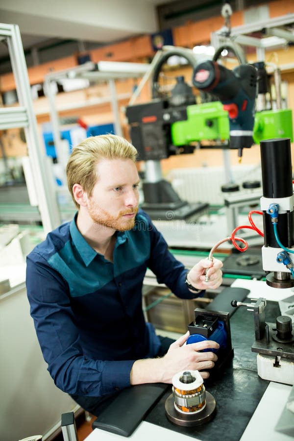 Young Man in Electronics Workshop Stock Image - Image of work ...