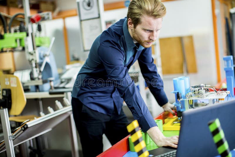 Young Man in Electronics Workshop Stock Image - Image of electricity ...