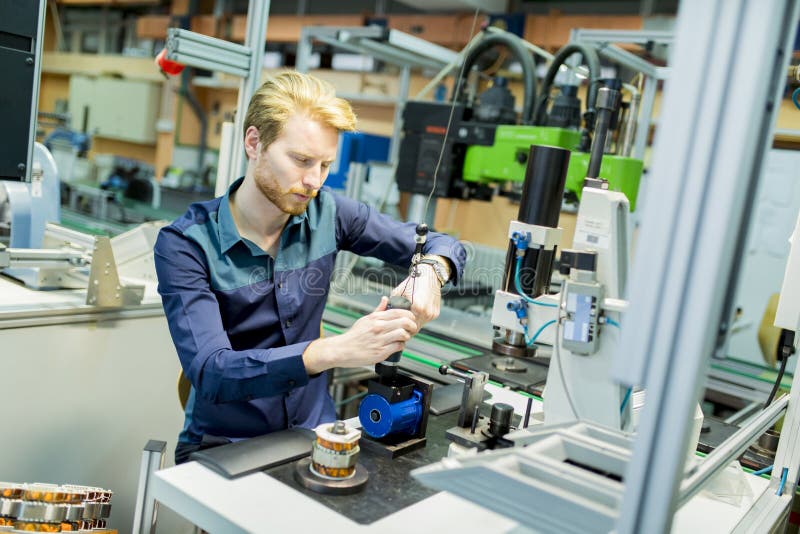Young Man in Electronics Workshop Stock Photo - Image of young ...