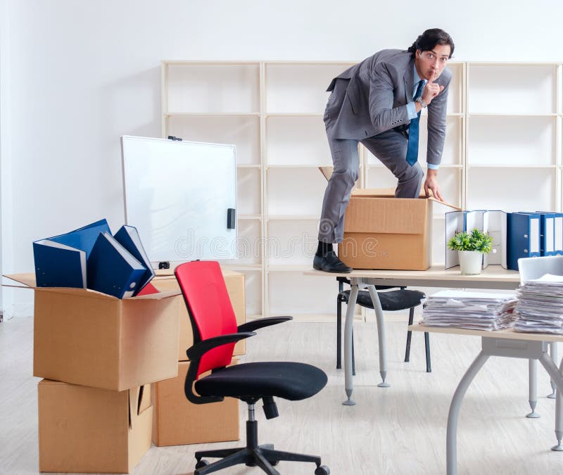 Young Man Employee with Boxes in the Office Stock Image - Image of ...