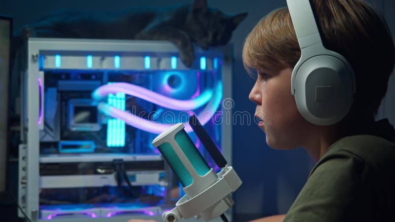 A Young Man Engages in Vocal Communication with His Peers through a ...