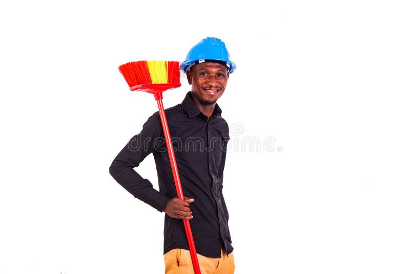 Young Man Engineer Holding a Broom Smiling Stock Photo - Image of ...