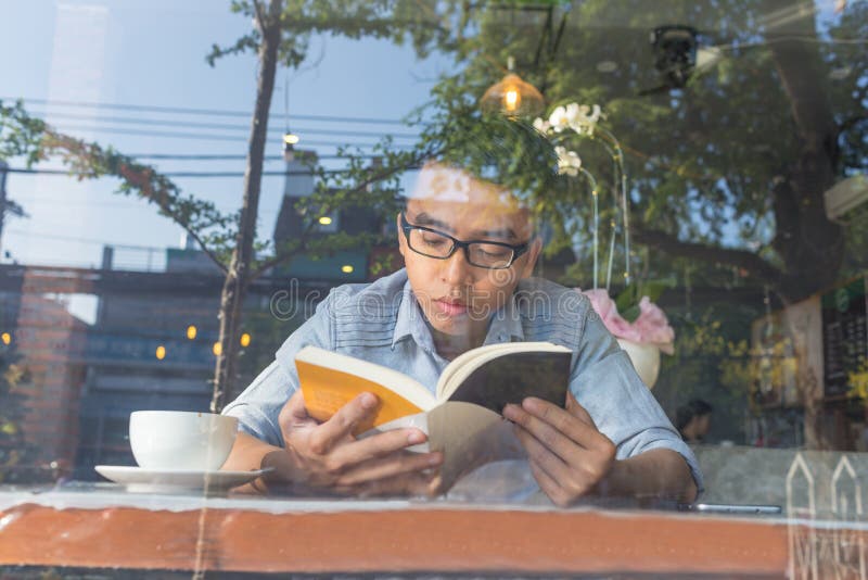 Young Man Enjoy Free Time with Book Stock Photo - Image of computer ...