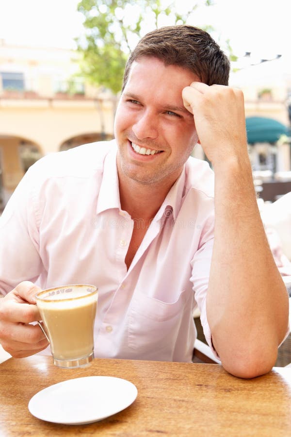 Young Man Enjoying Cup of Coffee Stock Photo - Image of mall, inside ...