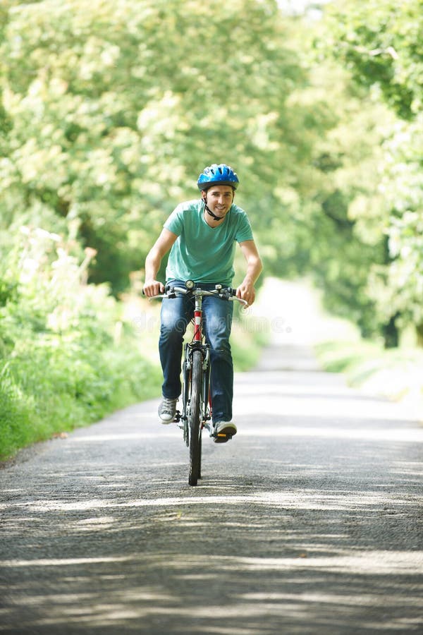 Close Up of Man Riding Bike in Cycle Lane Stock Photo - Image of ...