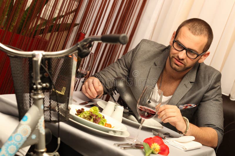 Young Man Enjoying Meal with a a Bike Stock Image - Image of office ...