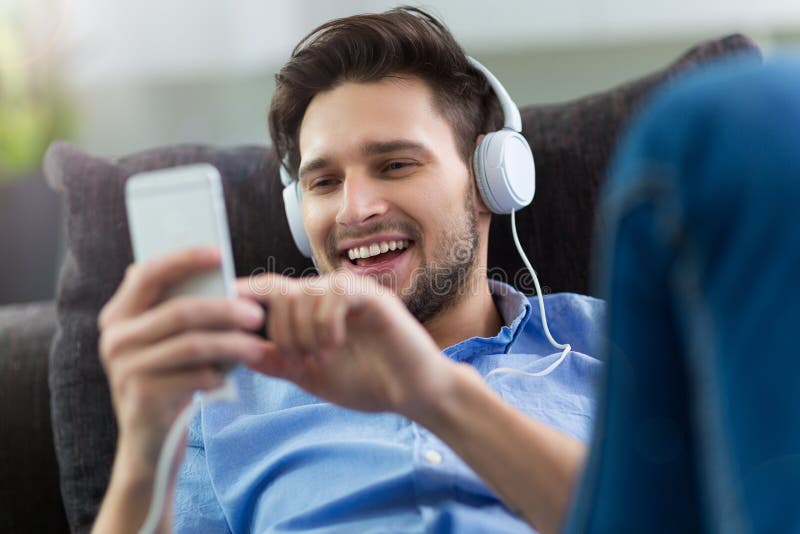 Young man enjoying music stock image. Image of enjoying - 69980805