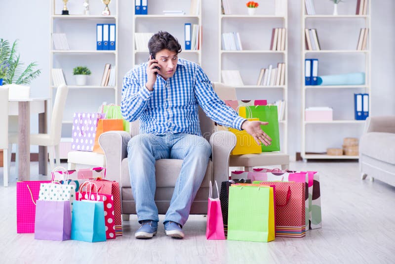 The Young Man after Excessive Shopping at Home Stock Photo - Image of ...