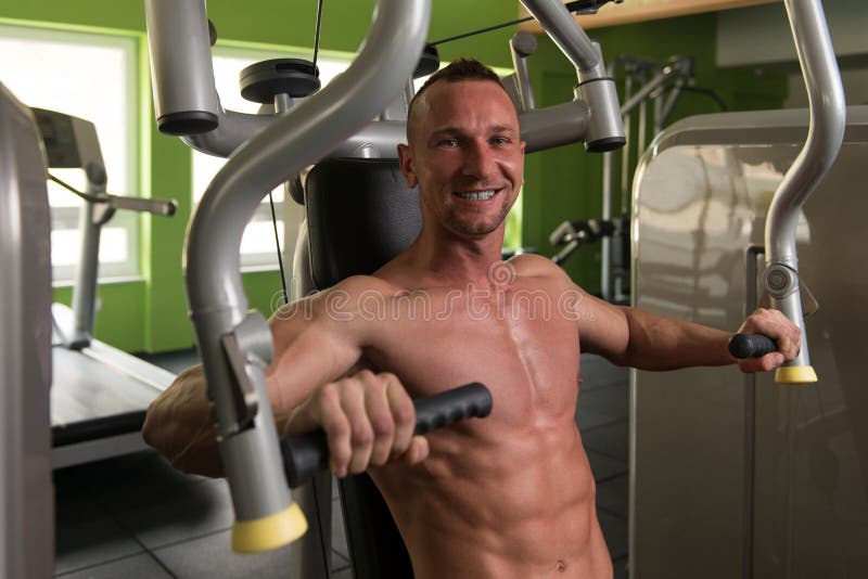 Young Man Exercising Chest in the Gym Stock Photo - Image of ...