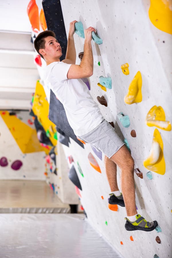 Young Man Exercising in Climbing Gym Stock Image - Image of effort ...