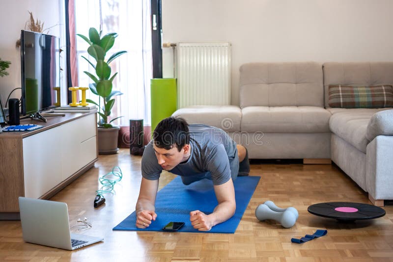 Man Exercising Doing Workout at Home Stock Image - Image of cozy ...