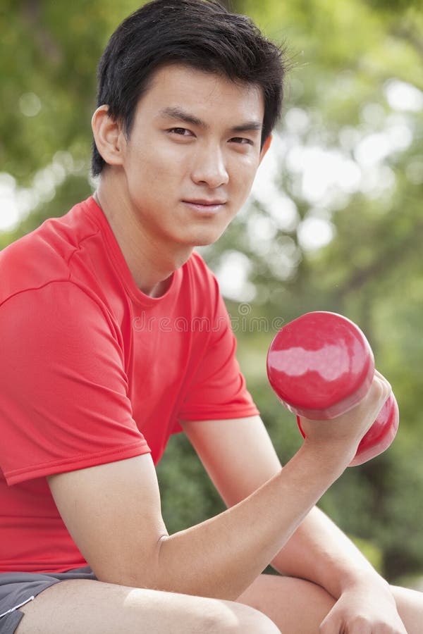 Young Man Exercising with Dumbbell Stock Photo - Image of dumbbell ...